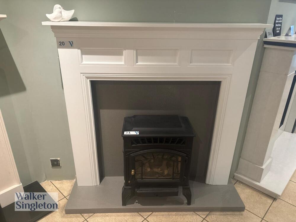 Traditional White fireplace surround with a tiered mantel and recessed ...