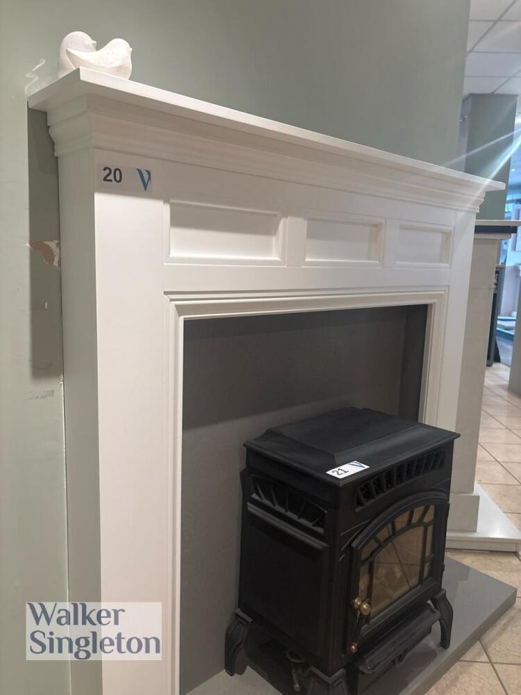 Traditional White fireplace surround with a tiered mantel and recessed ...